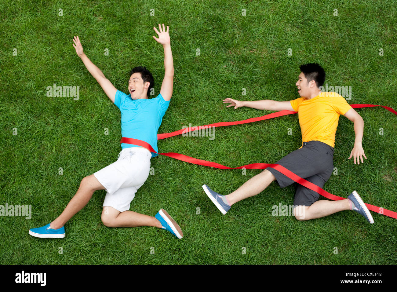 Creative young man imitating running attack on grass Stock Photo - Alamy