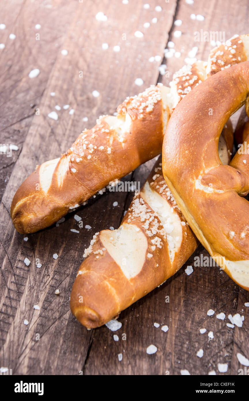 Pretzels with salt on wooden background Stock Photo - Alamy