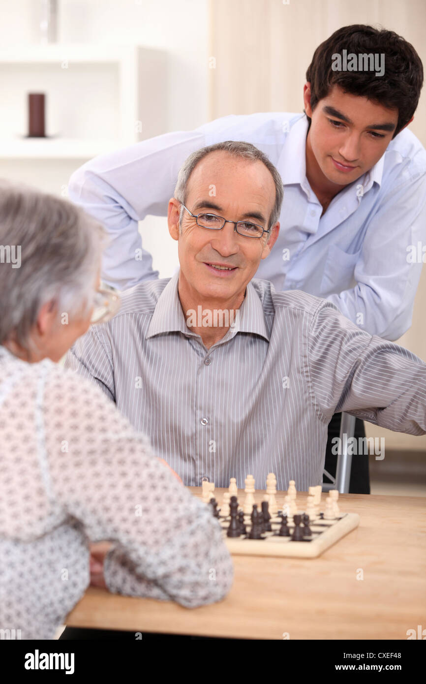 family playing chess Stock Photo - Alamy
