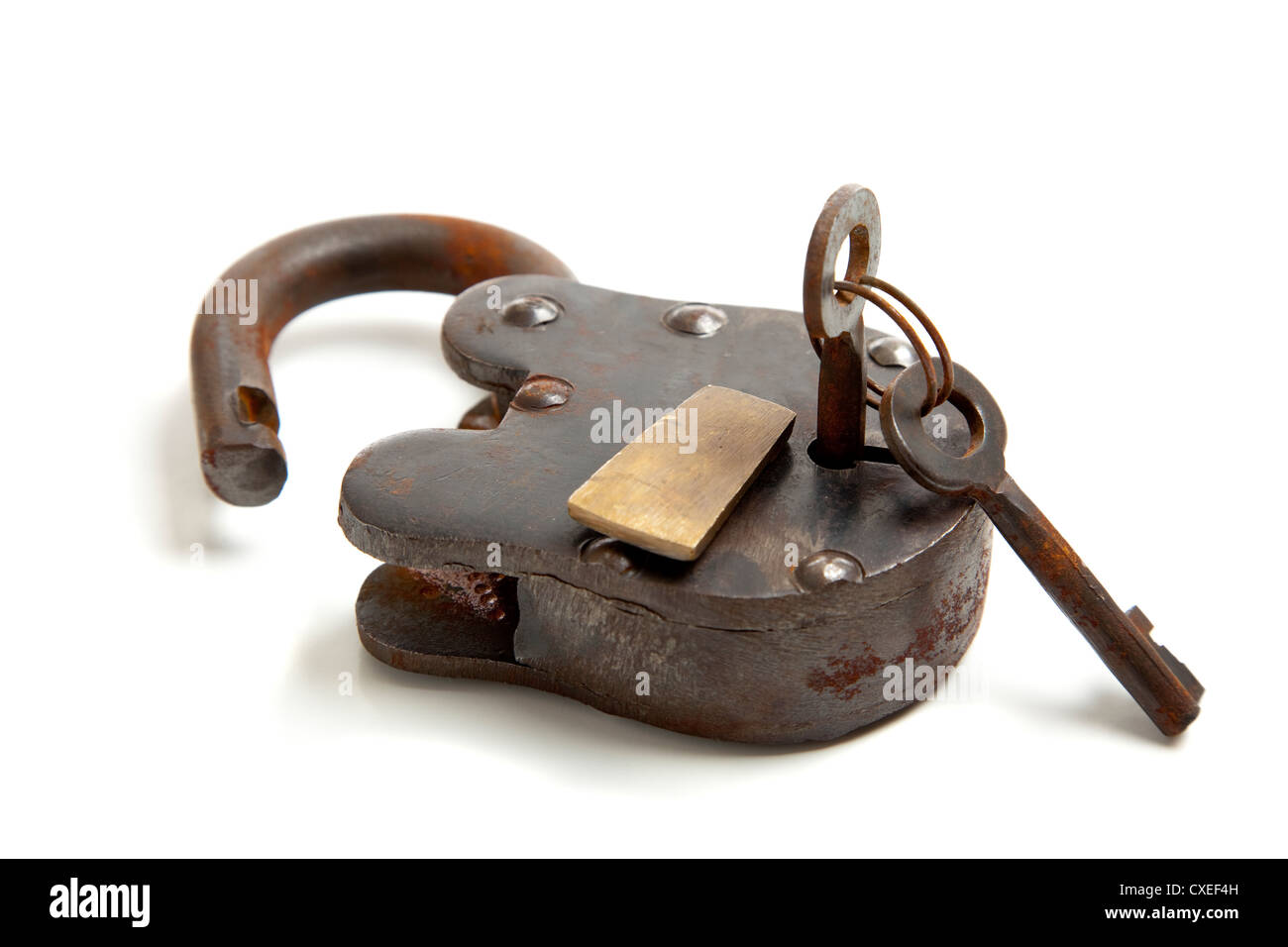 An old, antique vintage lock with keys on a white background Stock ...
