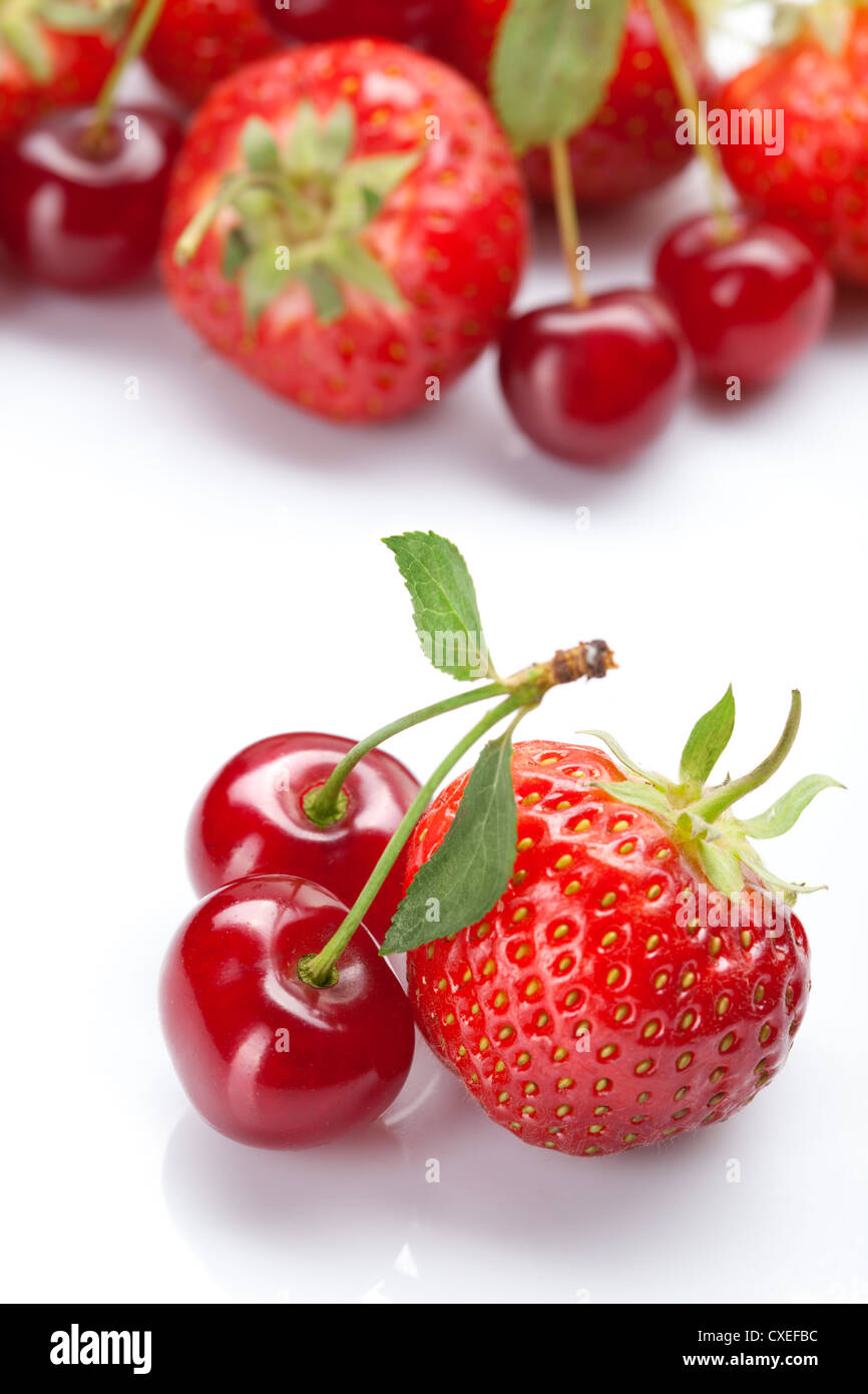 Strawberry and cherry on white Stock Photo - Alamy