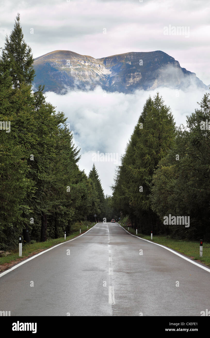 Wet shiny road, low cumulus clouds Stock Photo - Alamy