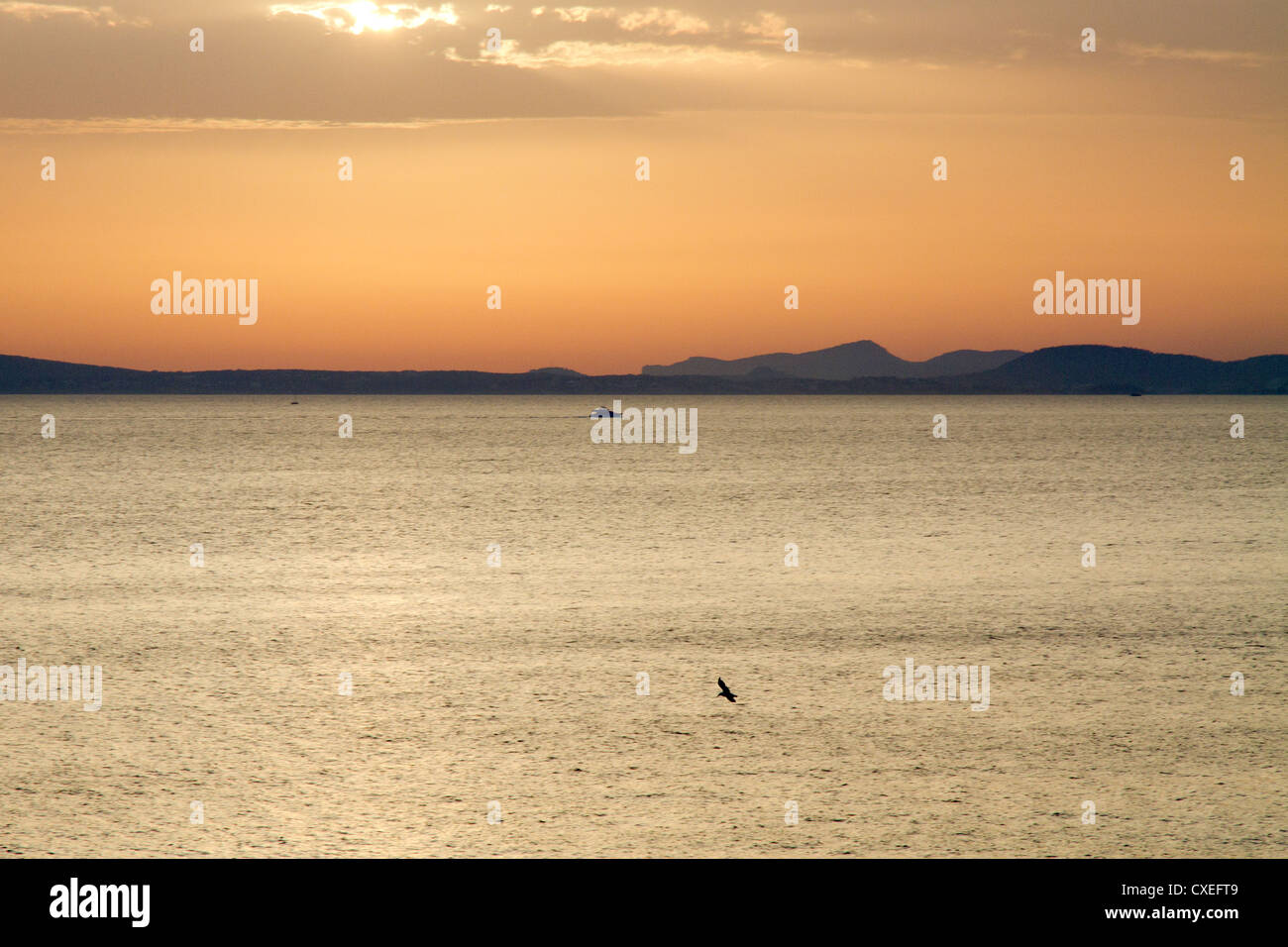 Sunset over sea water on coastline isle of Mallorca Balearic Spain ...