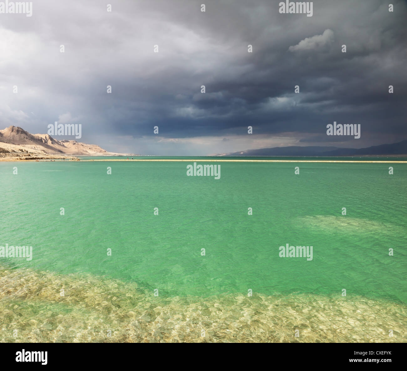 Multi-colored water in the shallows Stock Photo - Alamy
