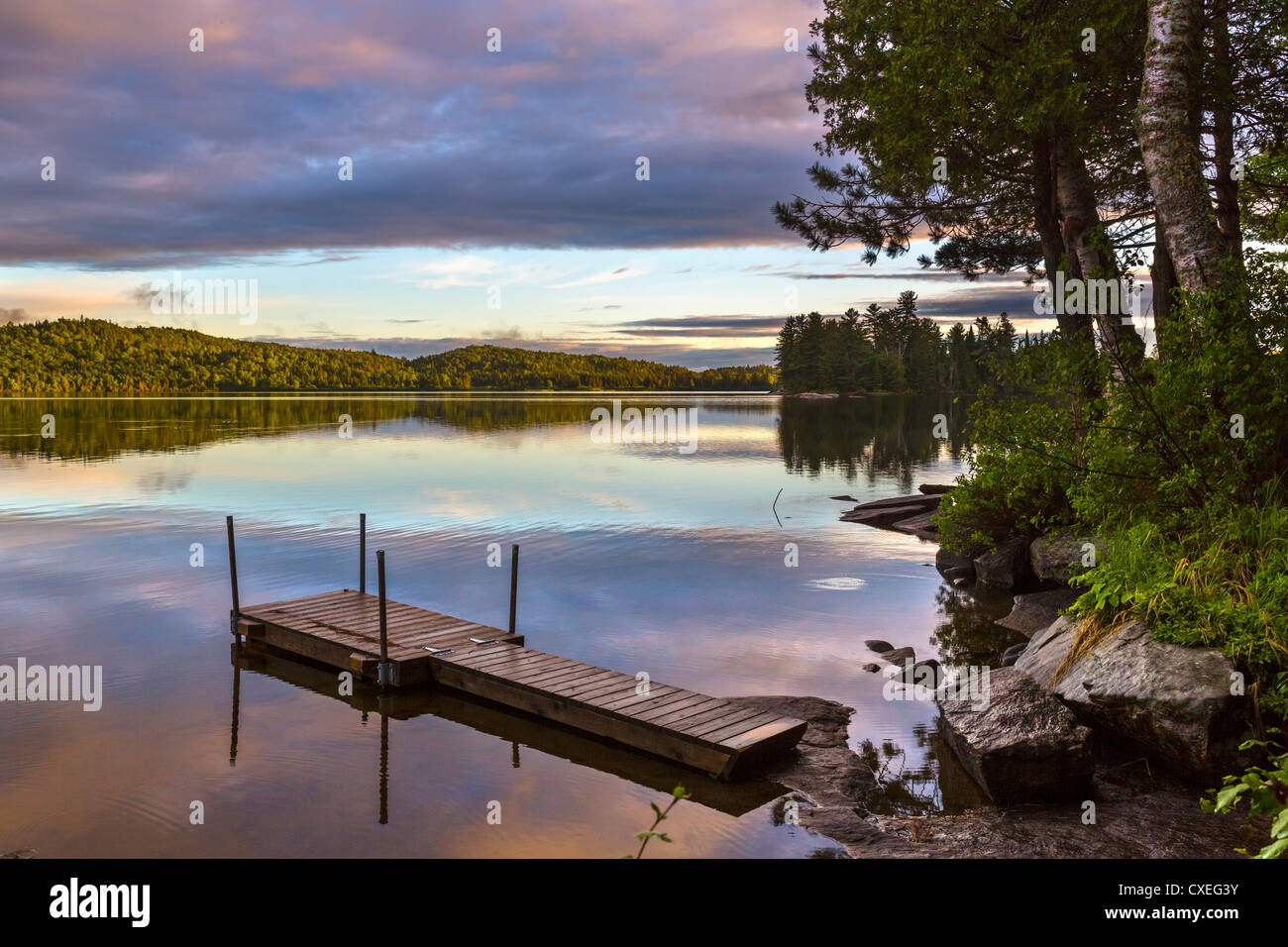 Lakefront at sunset at the Killarney Lodge resort, Lake of Two Rivers ...