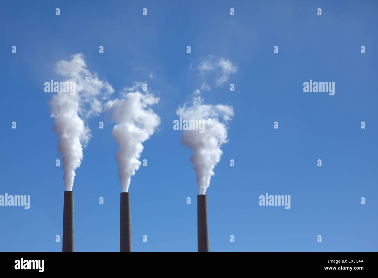 Three huge pipe smoke Stock Photo - Alamy