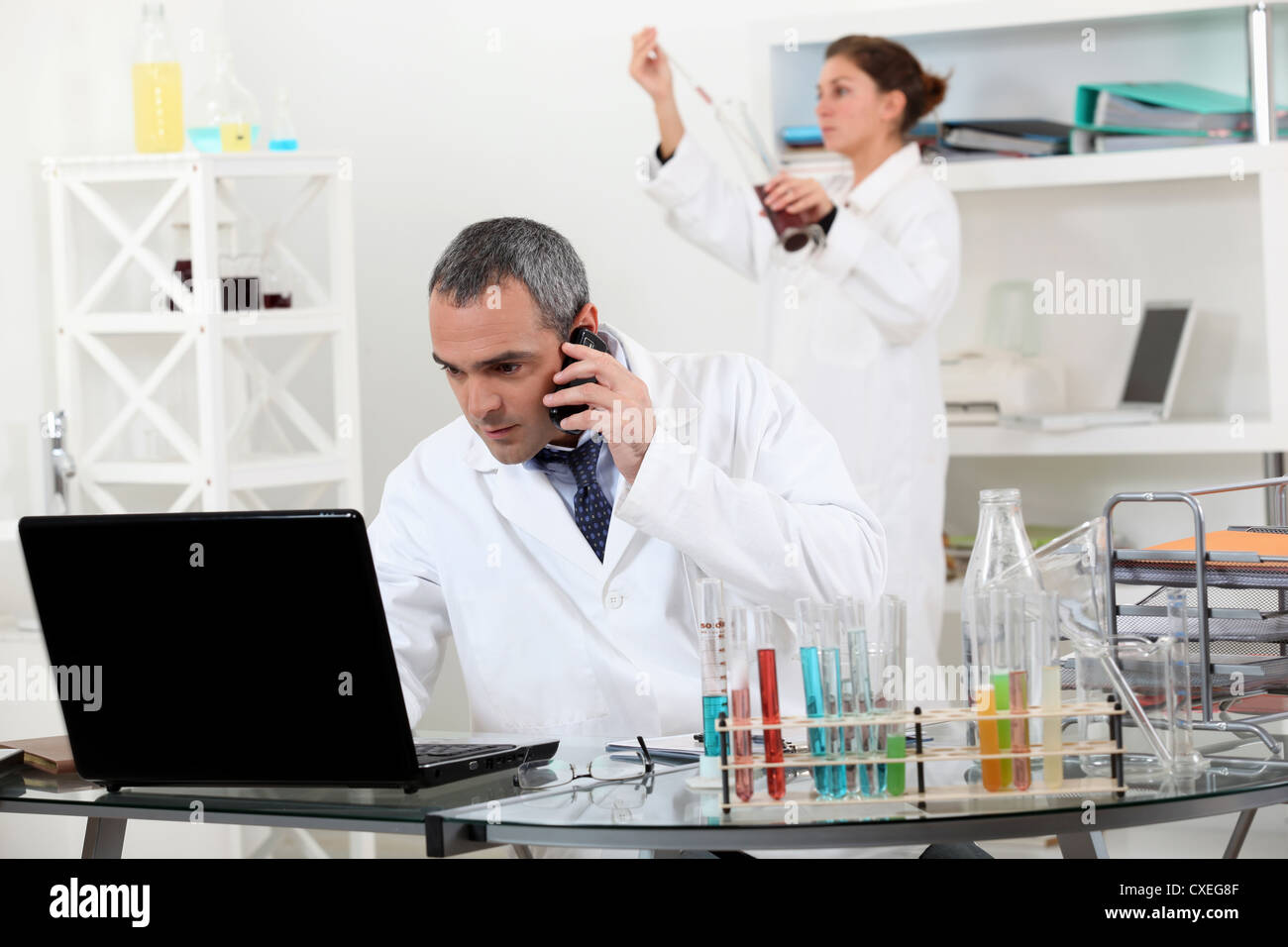 A pair of scientists conducting an experiment Stock Photo - Alamy
