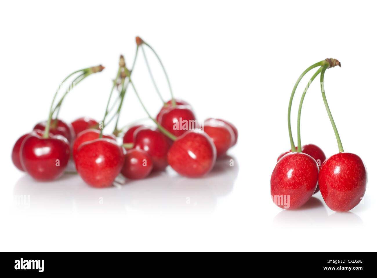 red cherry isolated on white Stock Photo - Alamy