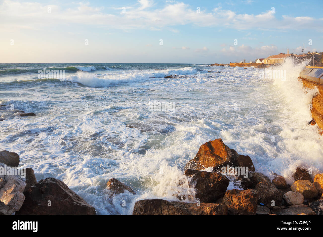 Storm waves crash against the rocks Stock Photo - Alamy