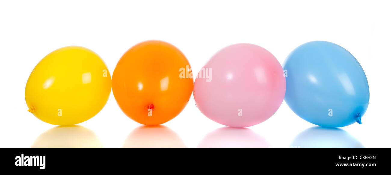 A row of colored balloons on a white background Stock Photo - Alamy