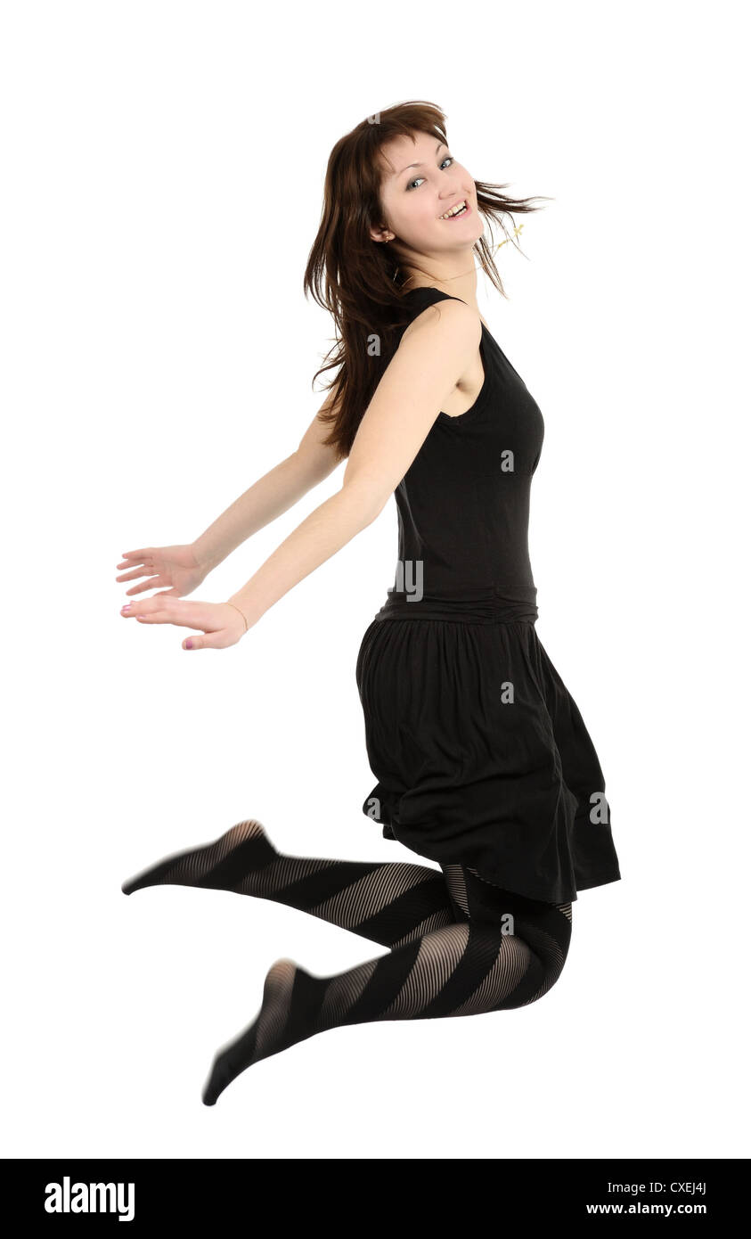 Girl in black dress jumping, isolated on a white background Stock Photo ...