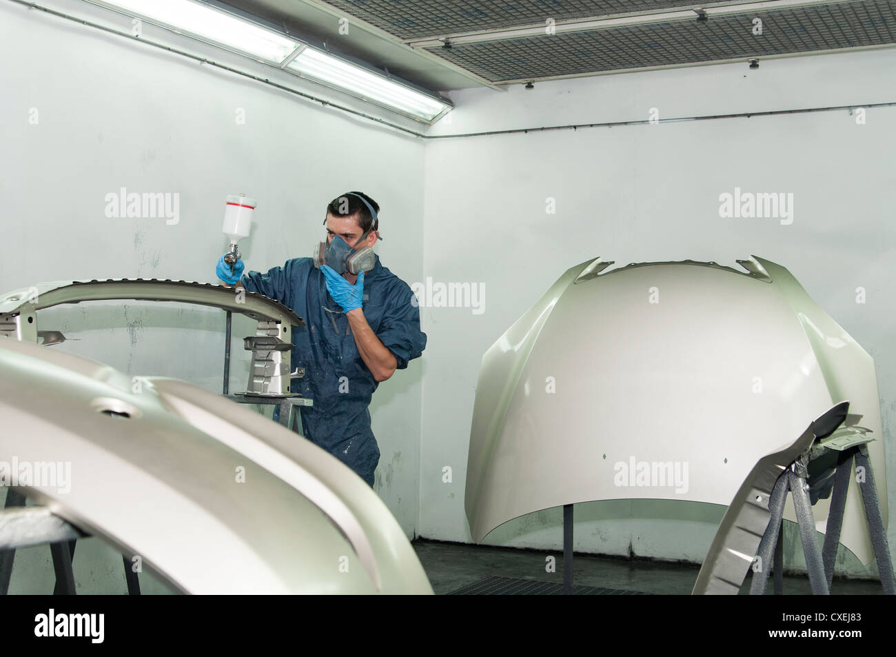 Worker painting a car Stock Photo - Alamy