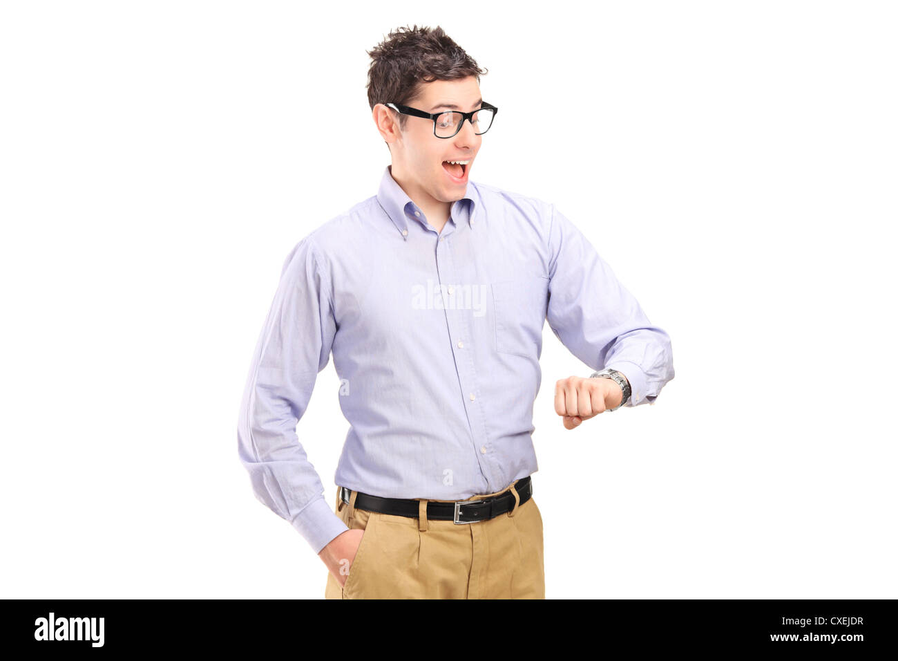 Portrait of a man looking at his watch isolated on white background ...