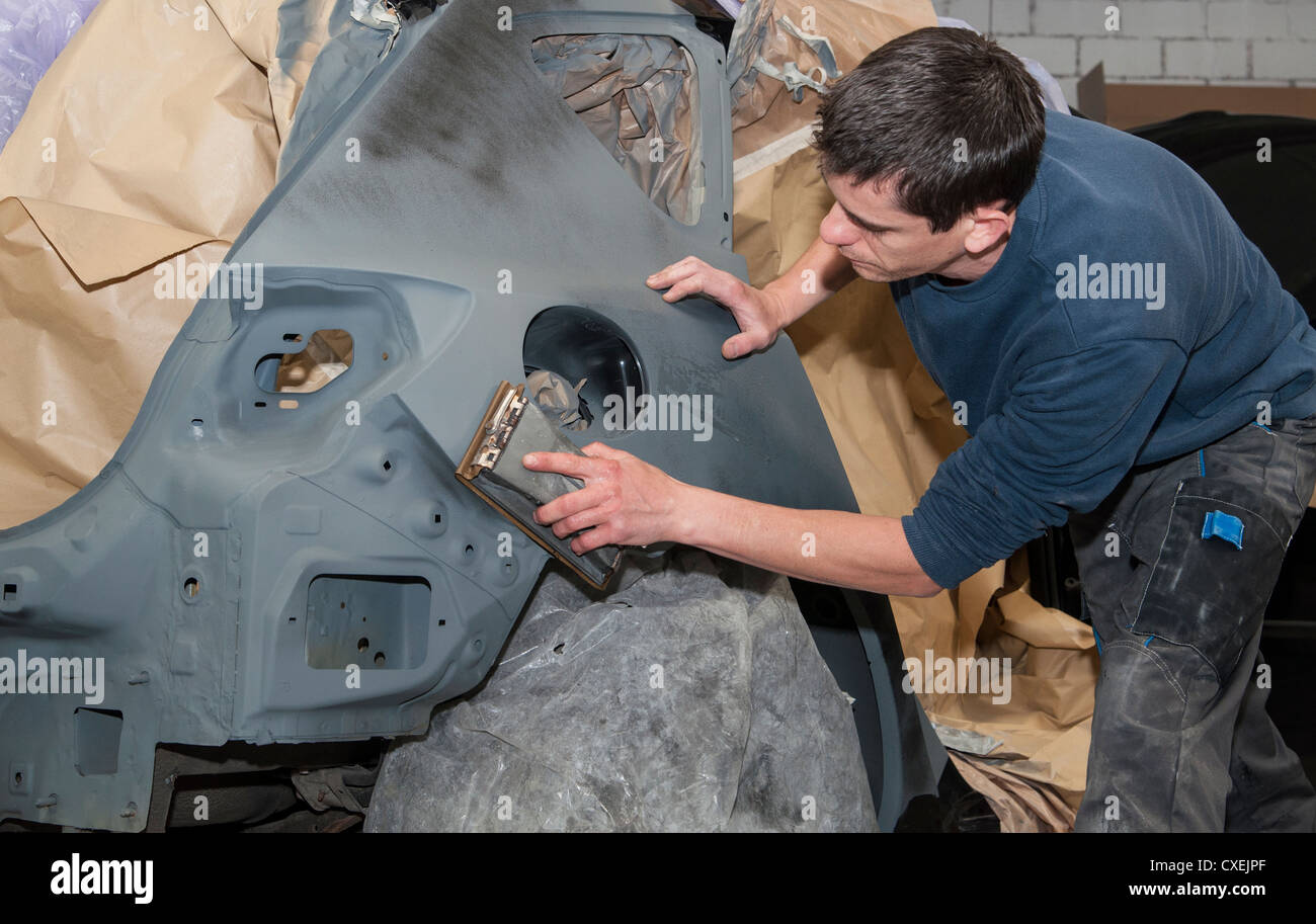 Car body worker Stock Photo - Alamy