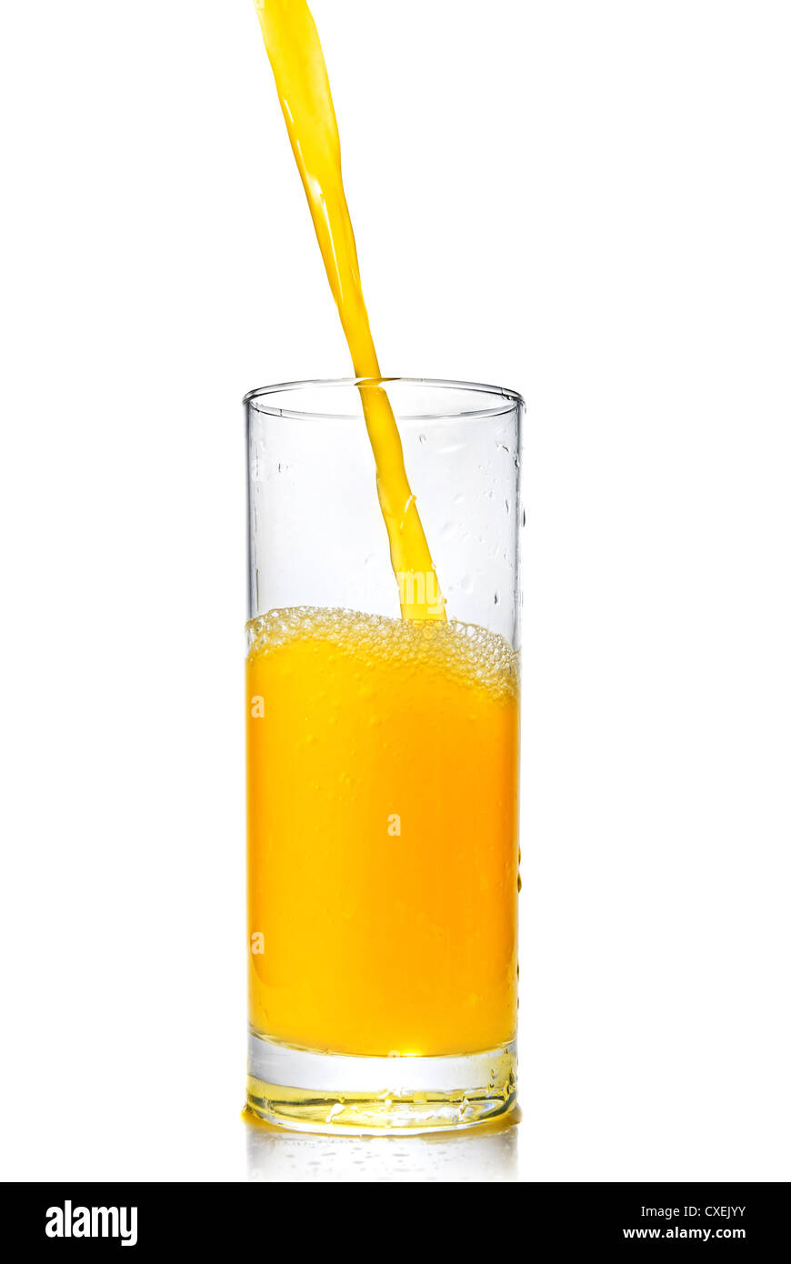 Pouring orange juice glass yellow Cut Out Stock Images & Pictures - Alamy