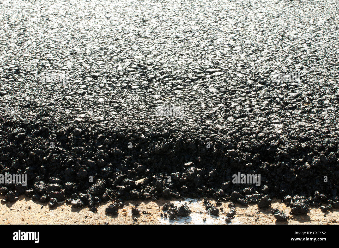 Asphalt and asphalting the road. Close up Stock Photo - Alamy