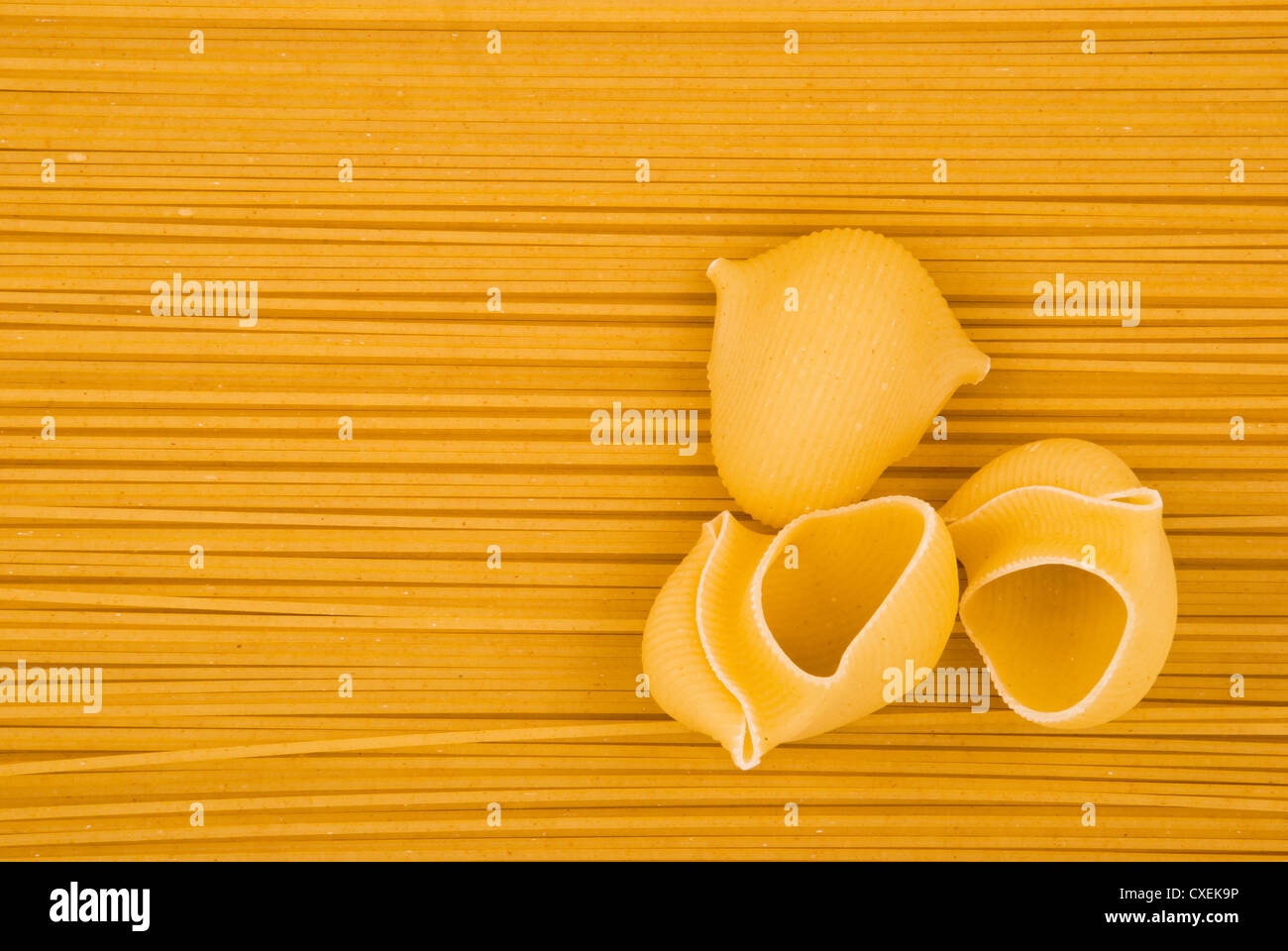Raw pasta background Stock Photo - Alamy