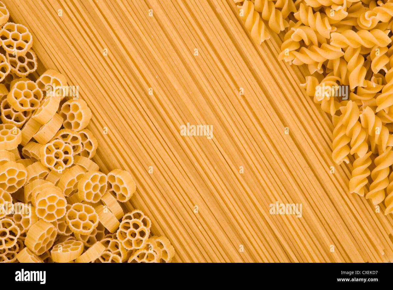 Raw pasta background Stock Photo - Alamy