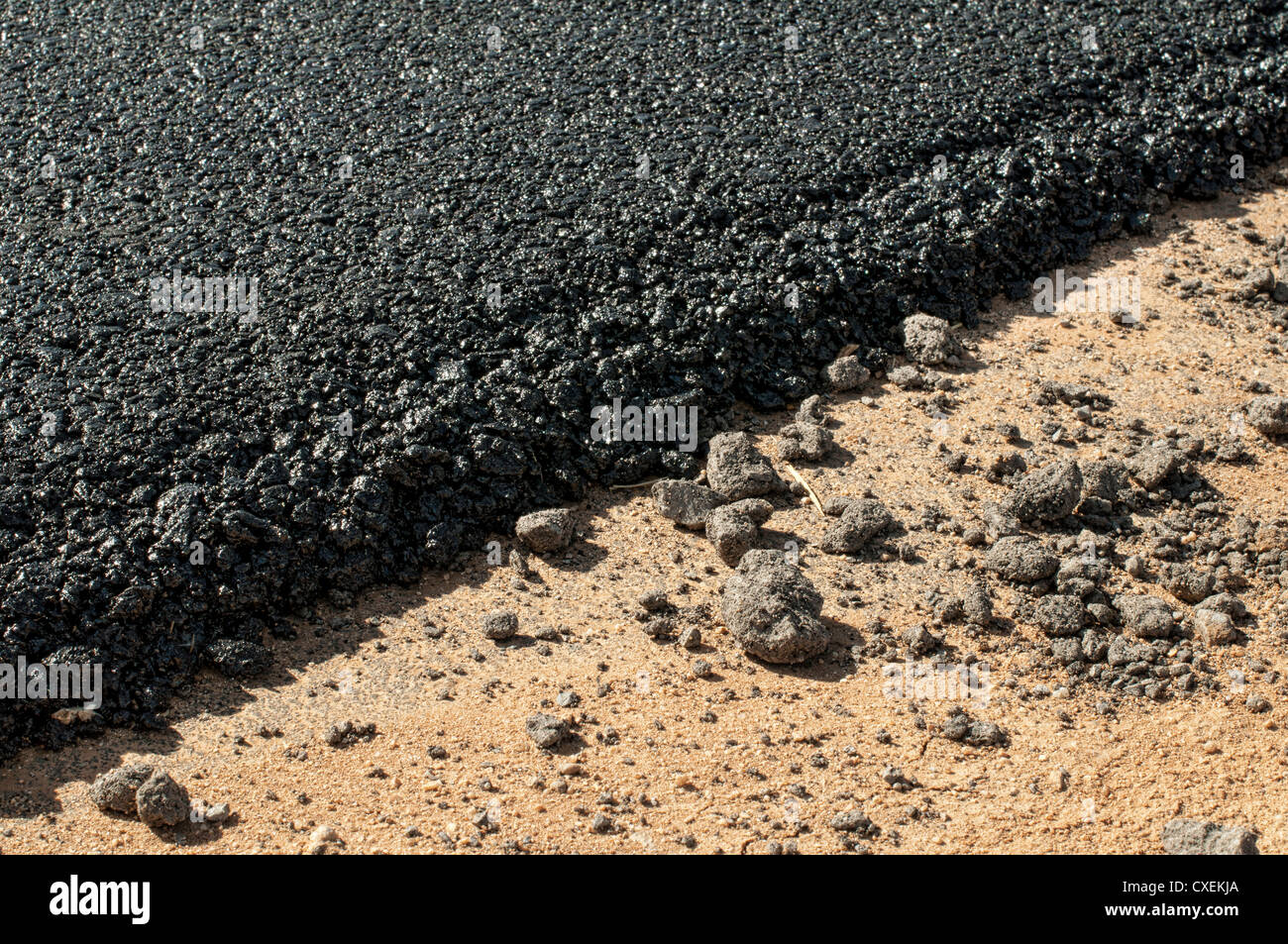 Asphalt and asphalting the road. Close up Stock Photo - Alamy