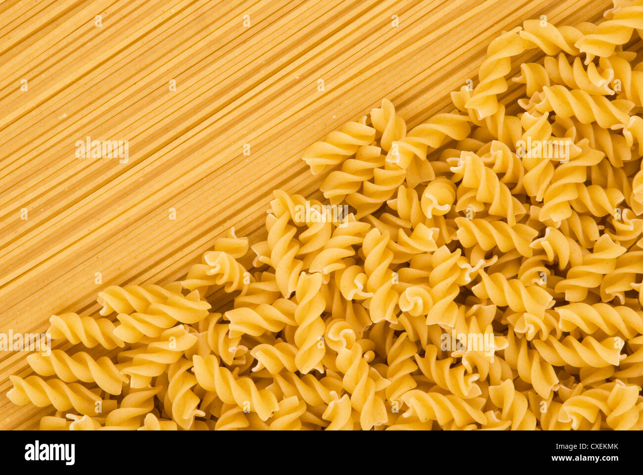 Raw pasta background Stock Photo - Alamy