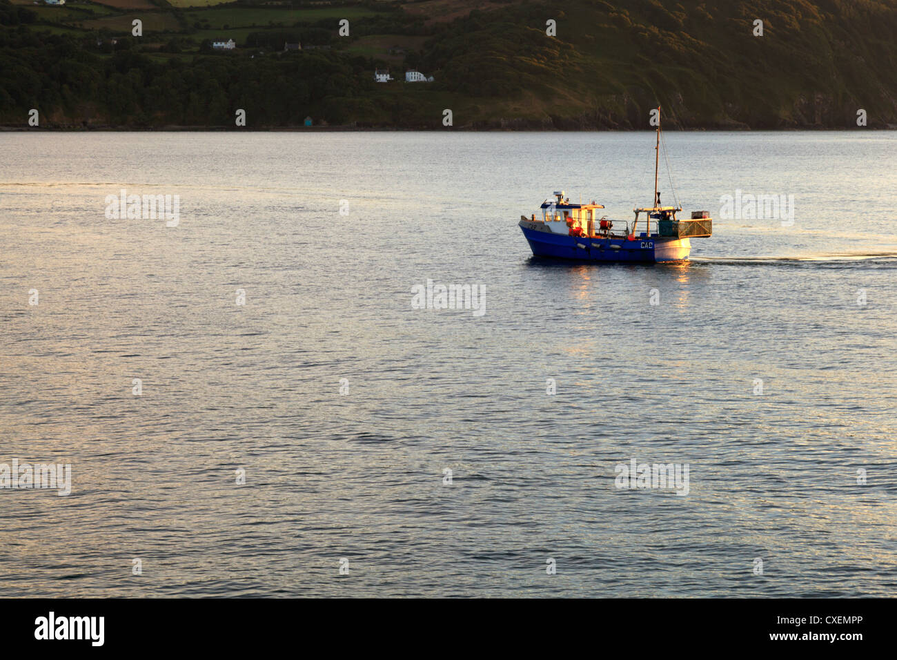 Lobster potter waiting for high tide to return to port on the Teifi ...