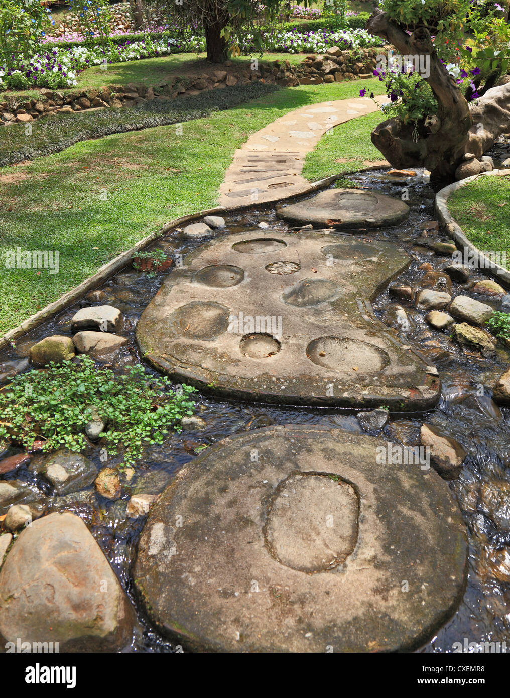 Footpath lined with decorative stones Stock Photo - Alamy