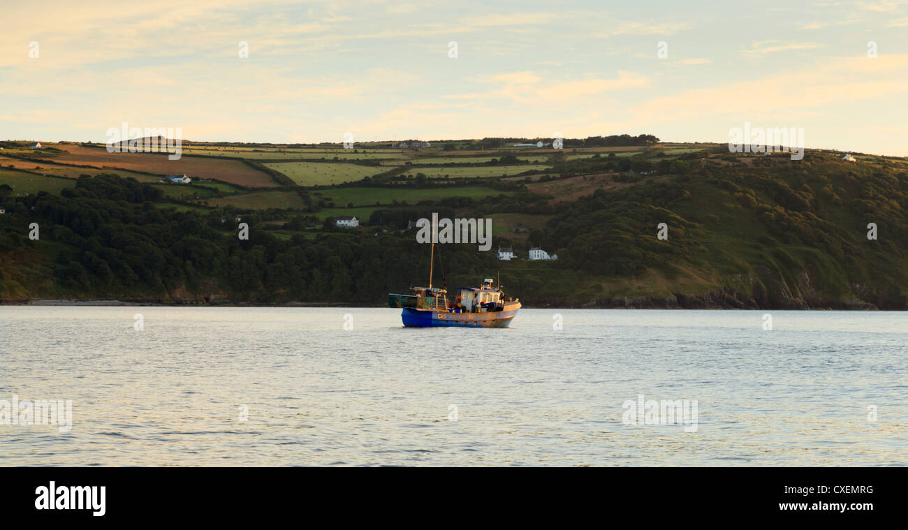 Lobster potter waiting for high tide to return to port on the Teifi ...