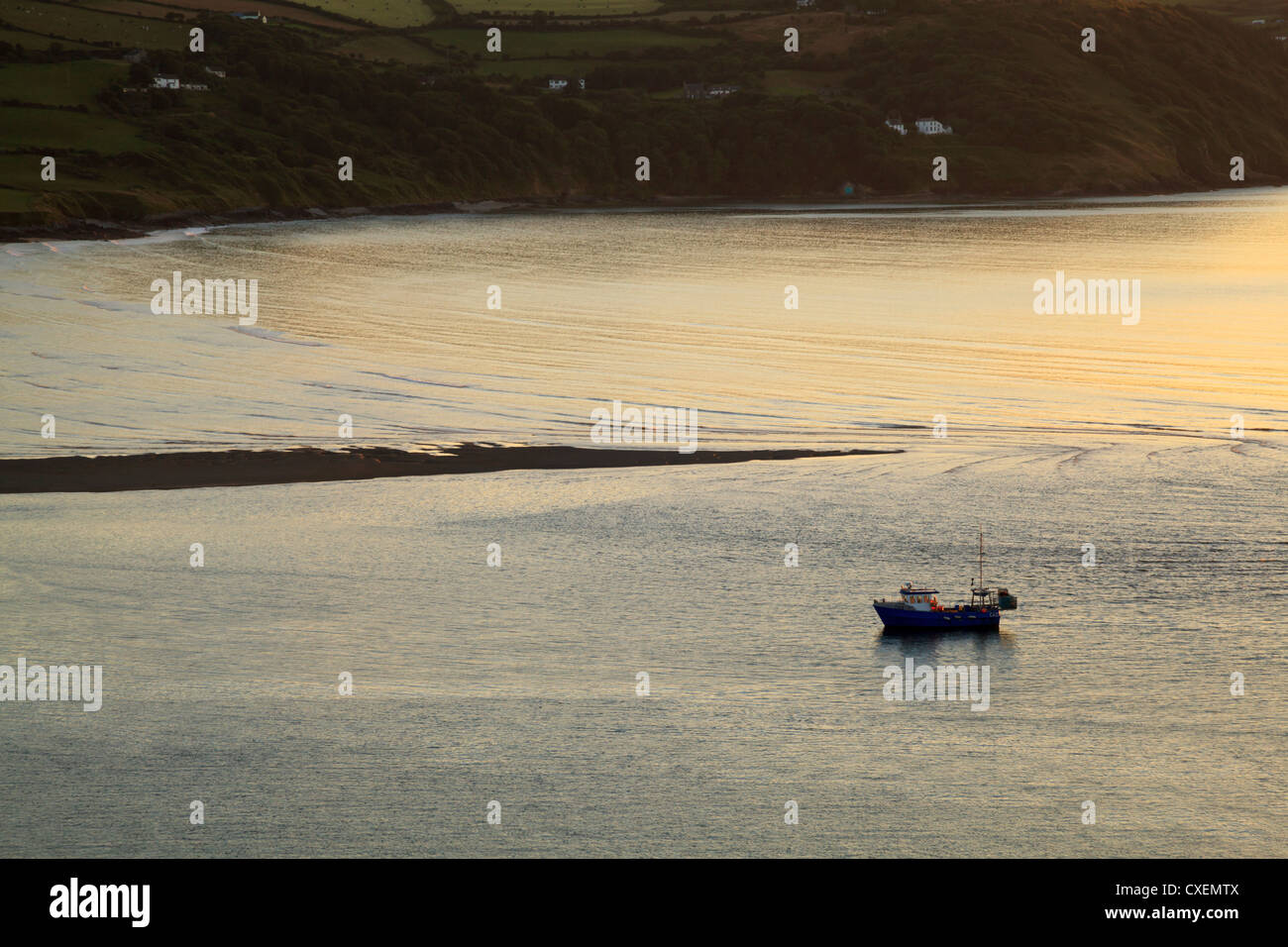 Lobster potter waiting for high tide to return to port on the Teifi ...