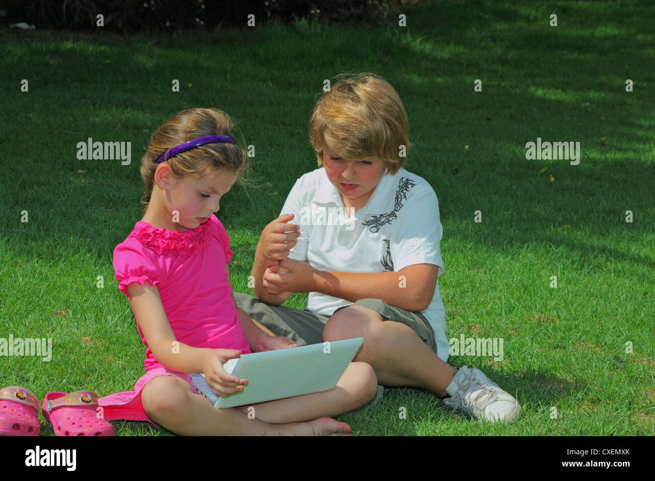 The brother and sister playing on computer Stock Photo - Alamy
