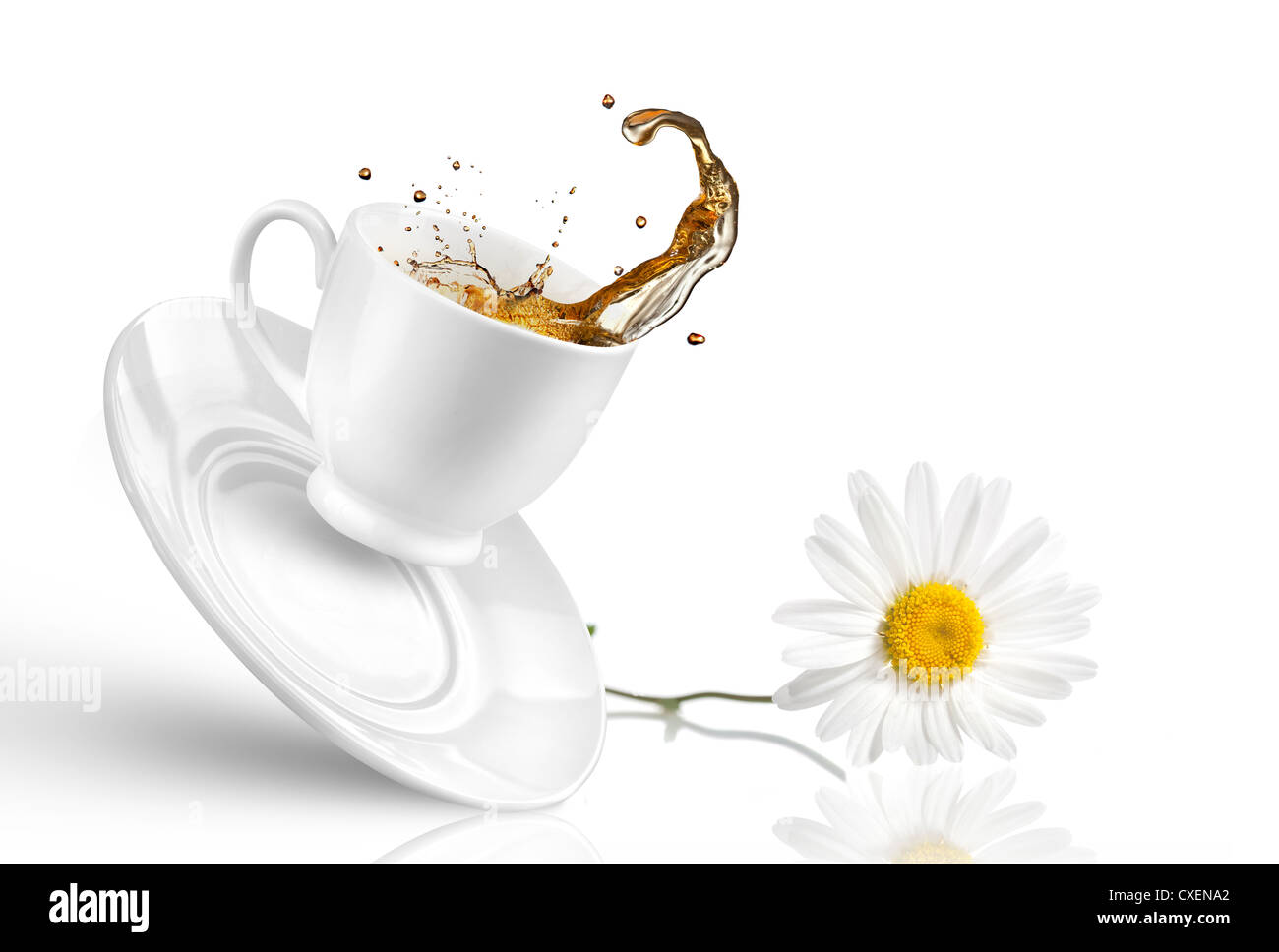 Splash of tea in the falling cup with flower isolated on white Stock ...