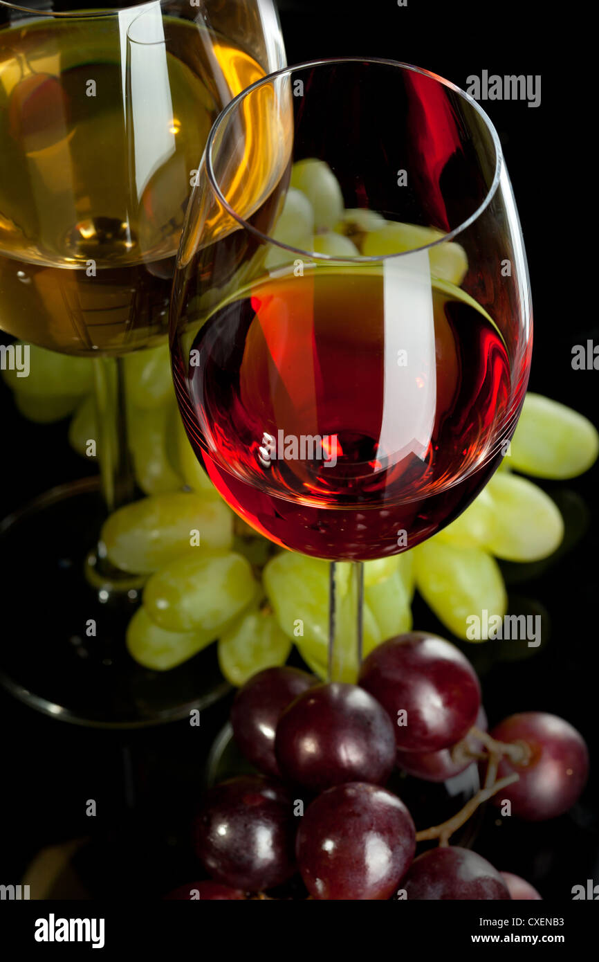 Red and white wine in glasses with grape. Top view Stock Photo - Alamy