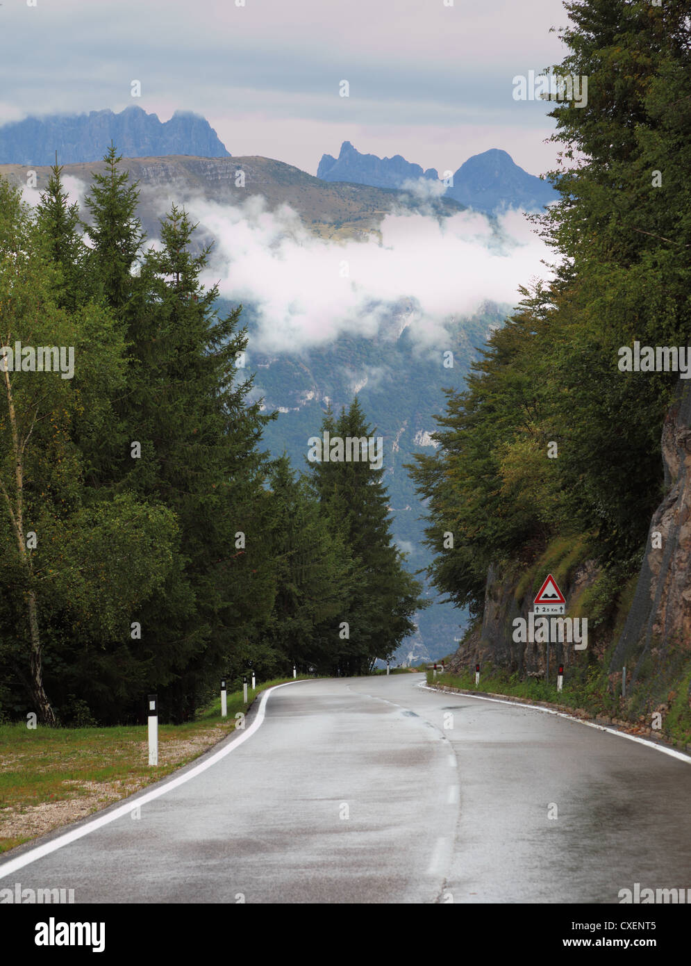 Wet road in the Swiss Alps Stock Photo - Alamy