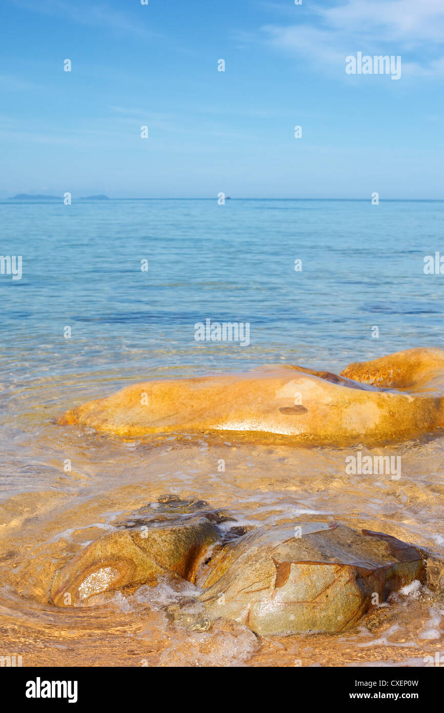 Stone in a Sea Stock Photo - Alamy