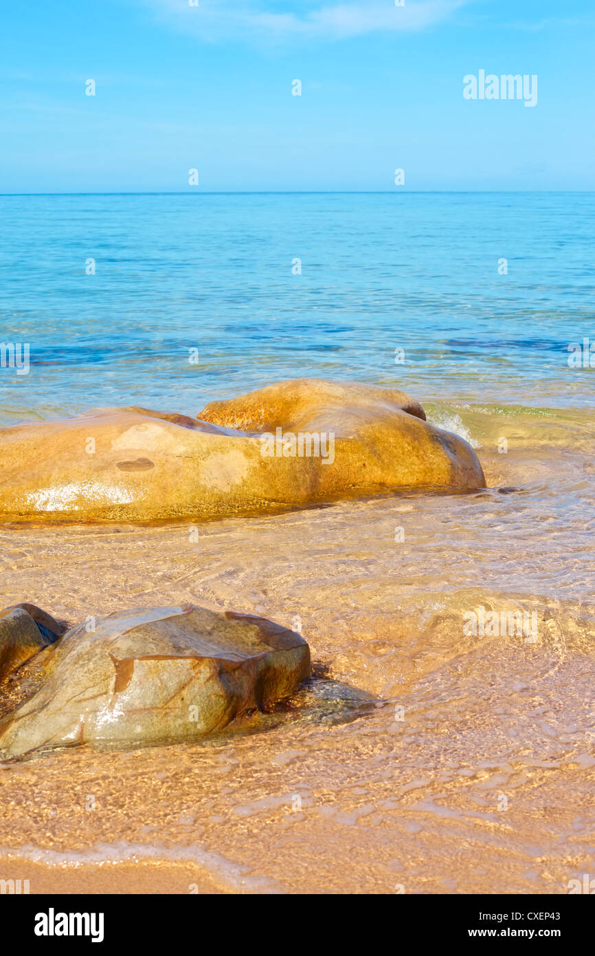 Stone in a Sea Stock Photo - Alamy