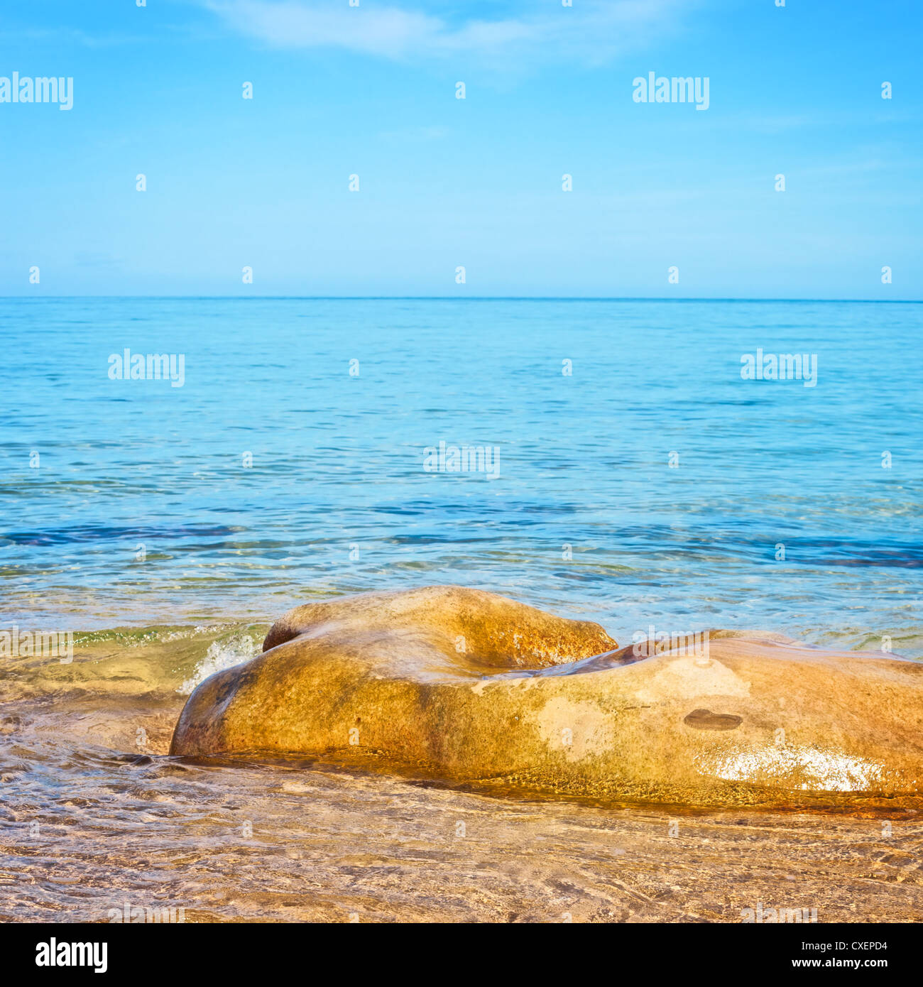 Stone in a Sea Stock Photo - Alamy