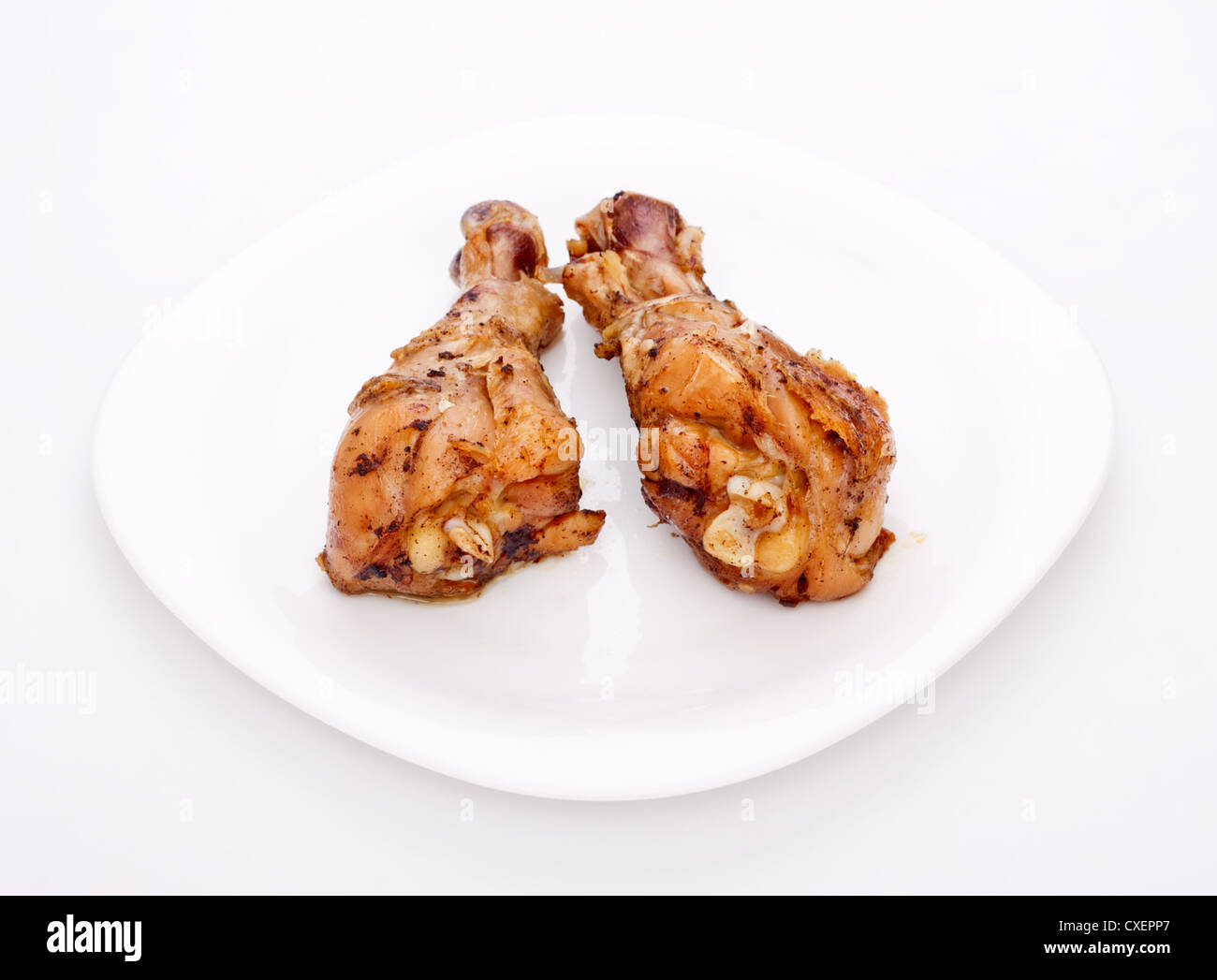 Two Fried Chicken Legs Stock Photo - Alamy