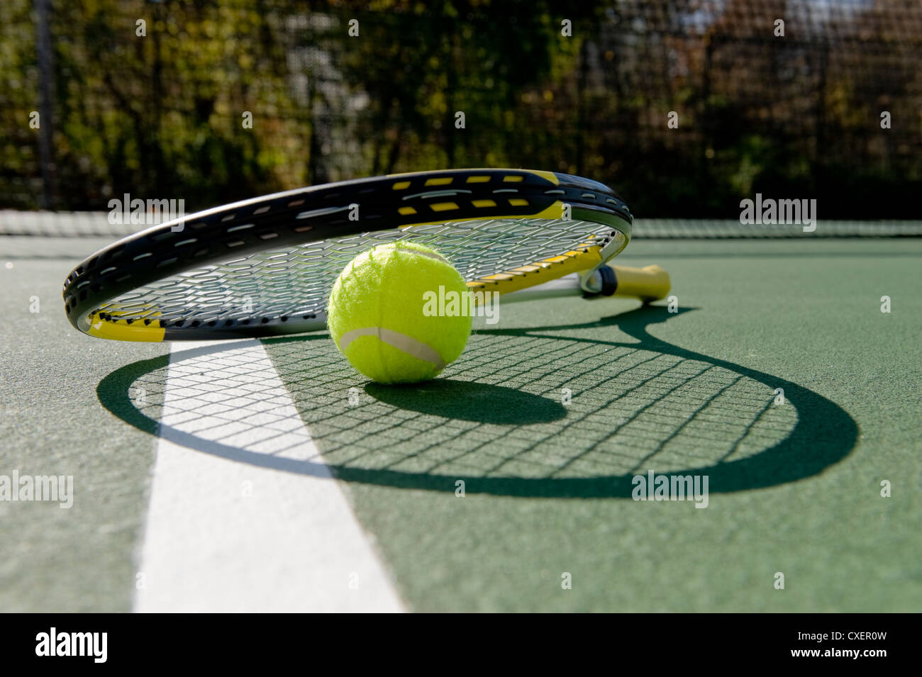 A tennis ball and racquet, racket on a white background Stock Photo - Alamy