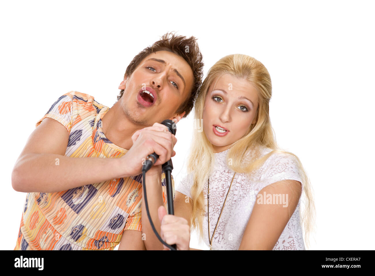 Attractive young couple singing Stock Photo - Alamy