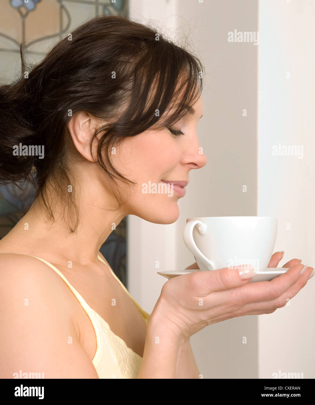 woman enjoying a cup of tea Stock Photo - Alamy