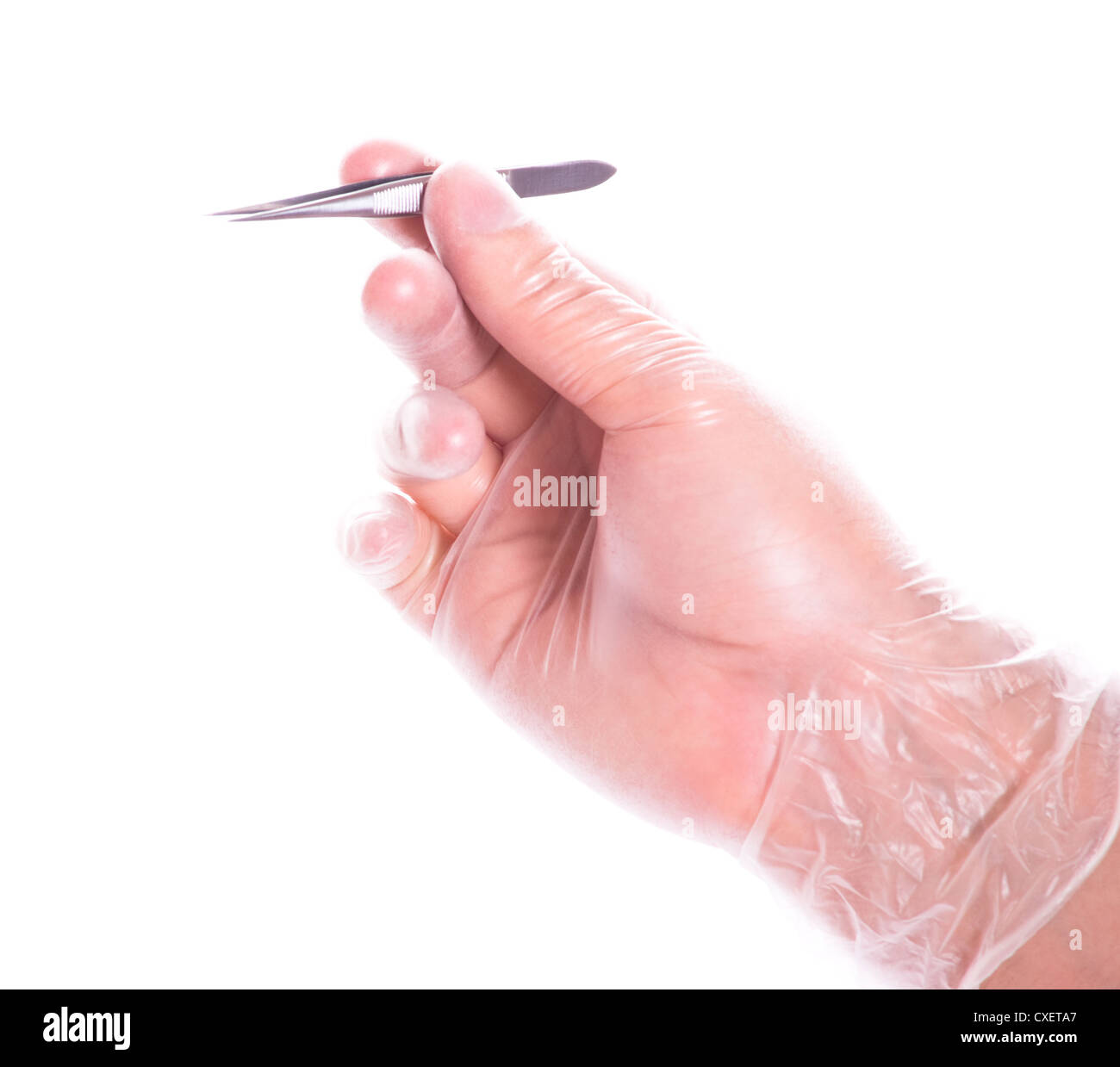 hand in rubber glove holding tweezers Stock Photo - Alamy