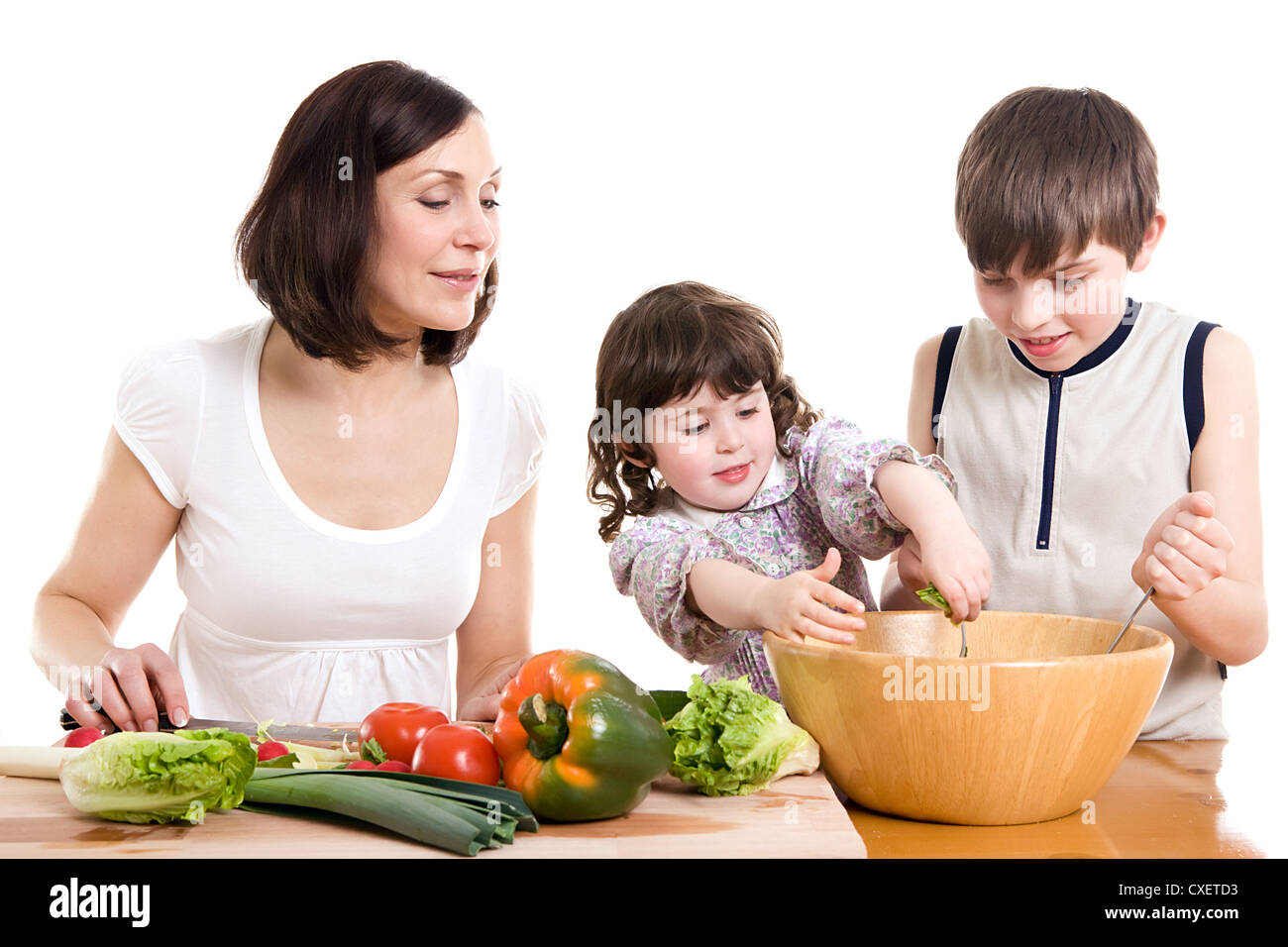 mother and children cooking at the kitchen Stock Photo - Alamy
