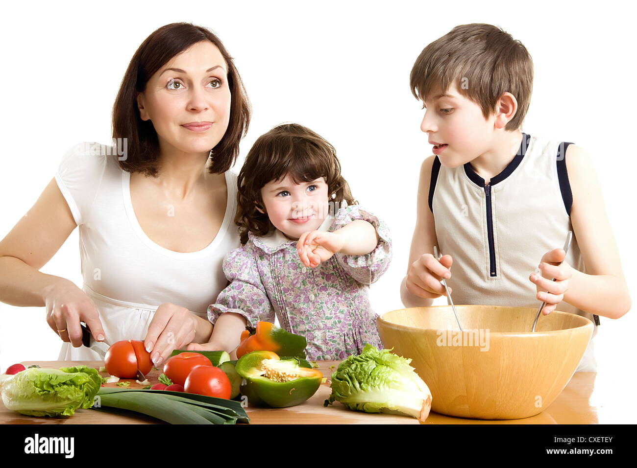 mother and children cooking at the kitchen Stock Photo - Alamy