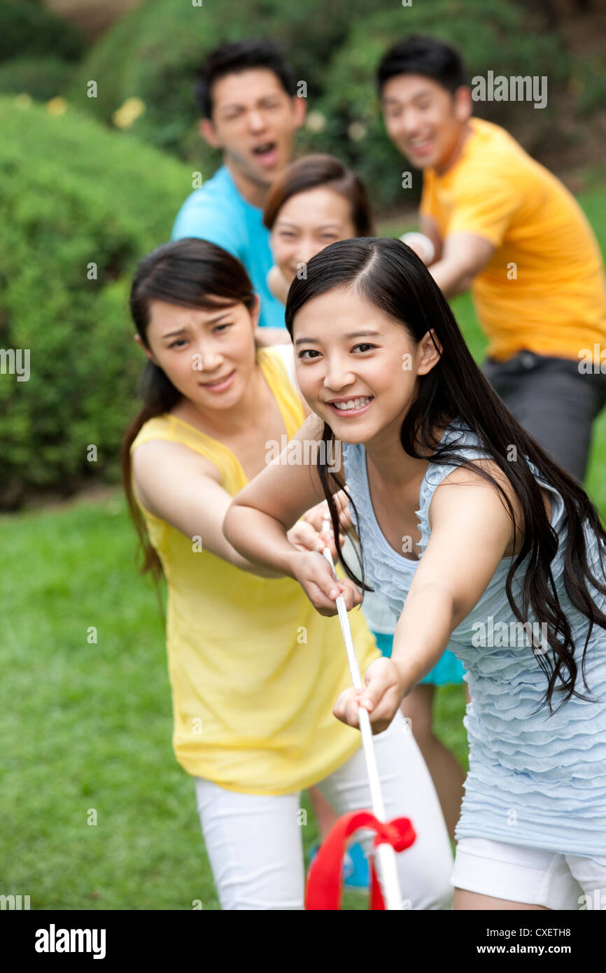 young people playing tug-of-war Stock Photo - Alamy