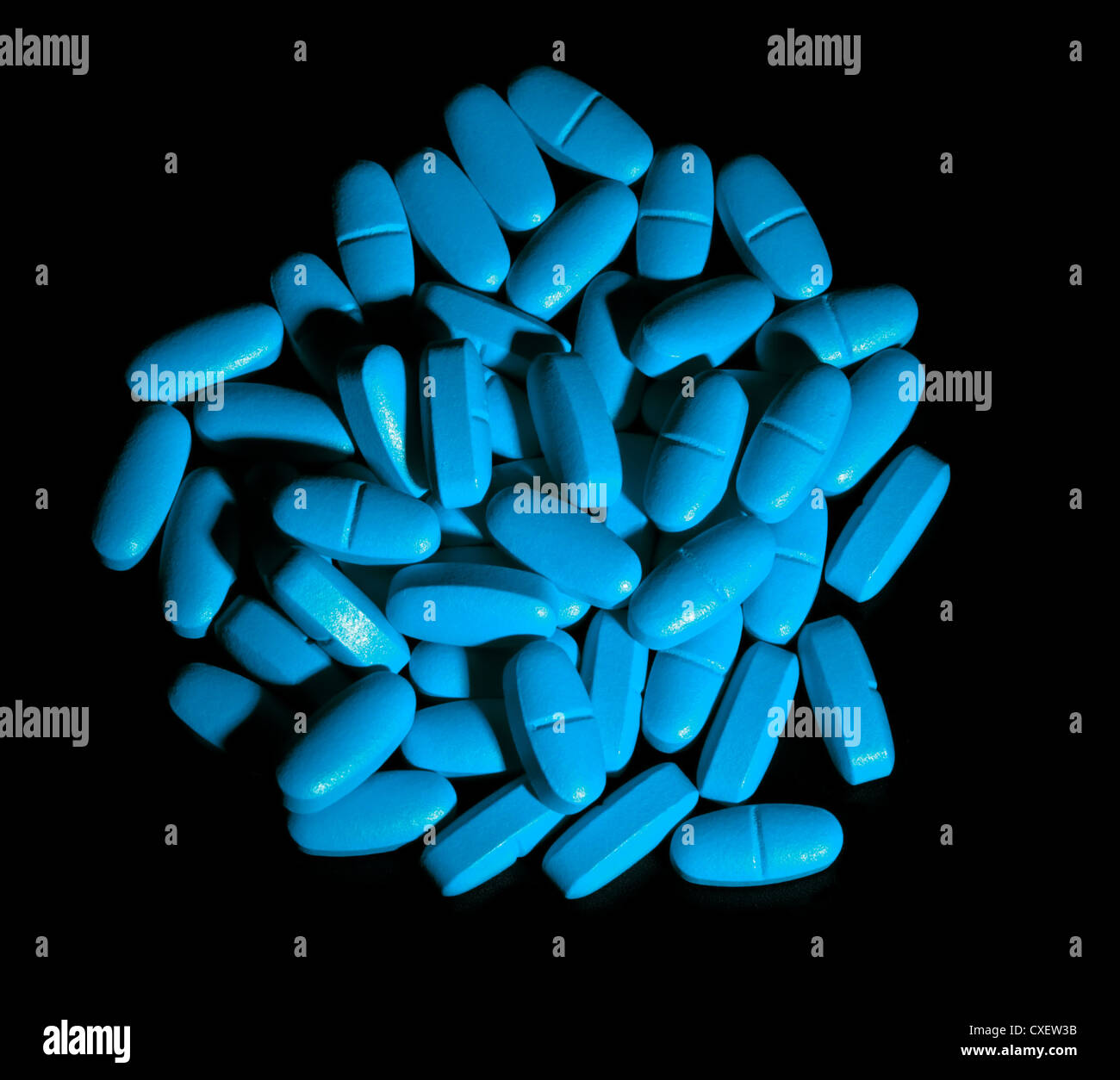 batch of blue pills Stock Photo - Alamy