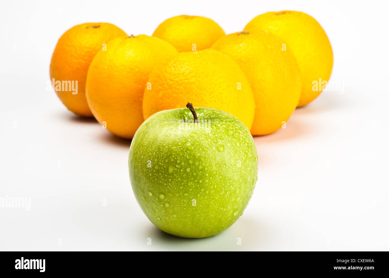 oranges and apple like billiard balls Stock Photo - Alamy