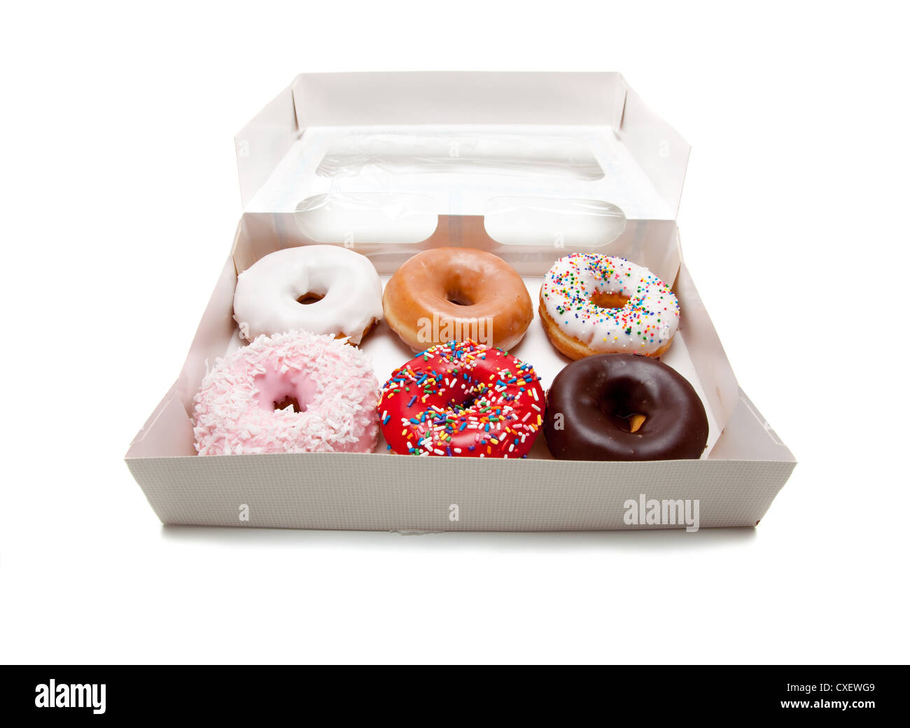 Boxed of iced and sprinkled topped donuts on a white background Stock ...