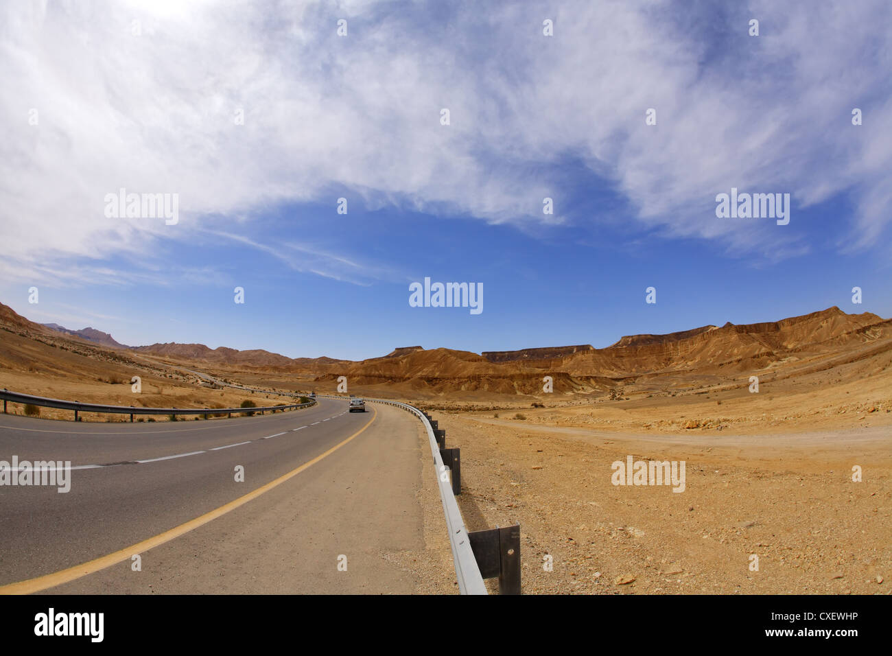 Asphalt highway in stone desert Stock Photo - Alamy