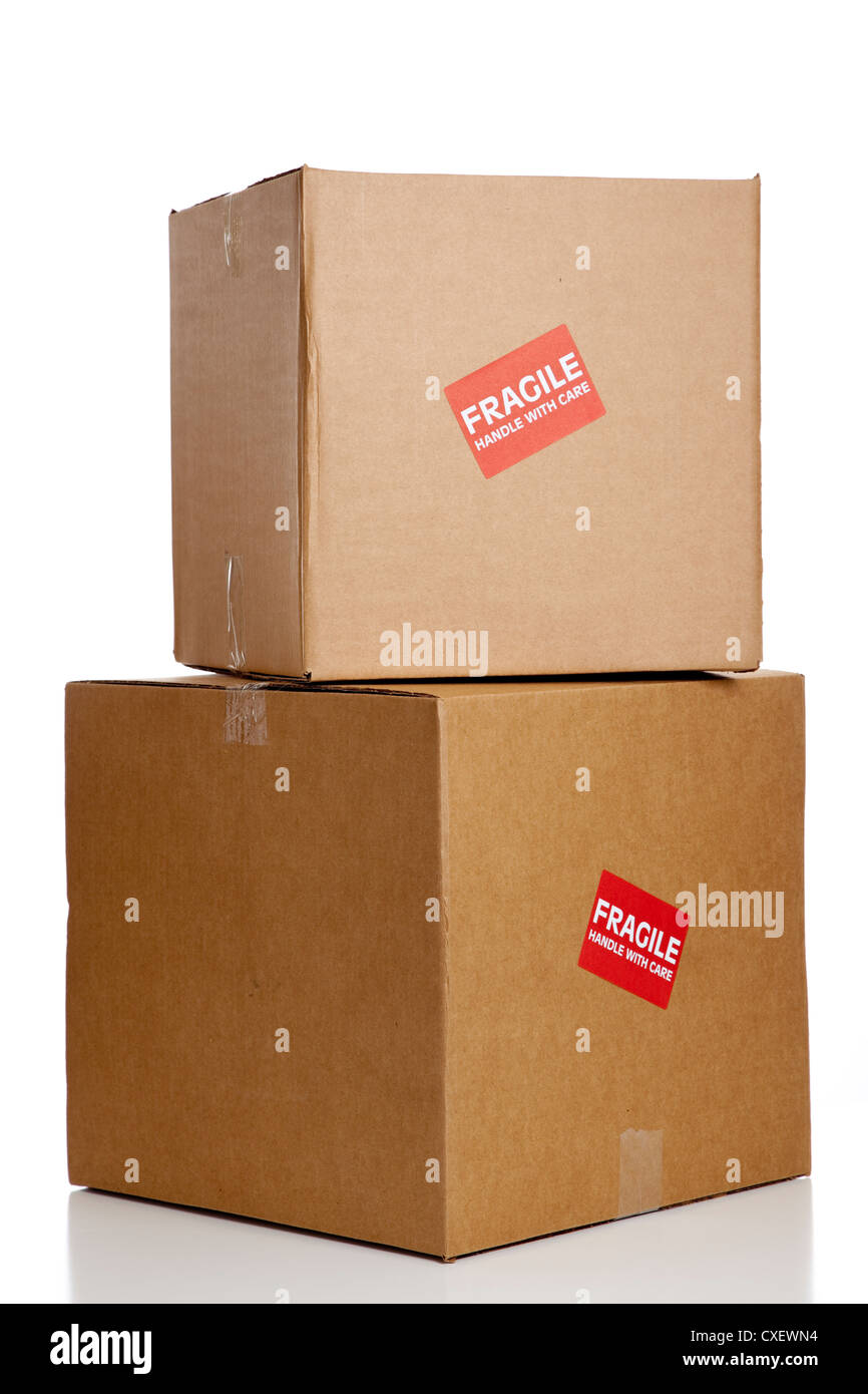 Stack of brown packing boxed with fragile stickers on them Stock Photo ...