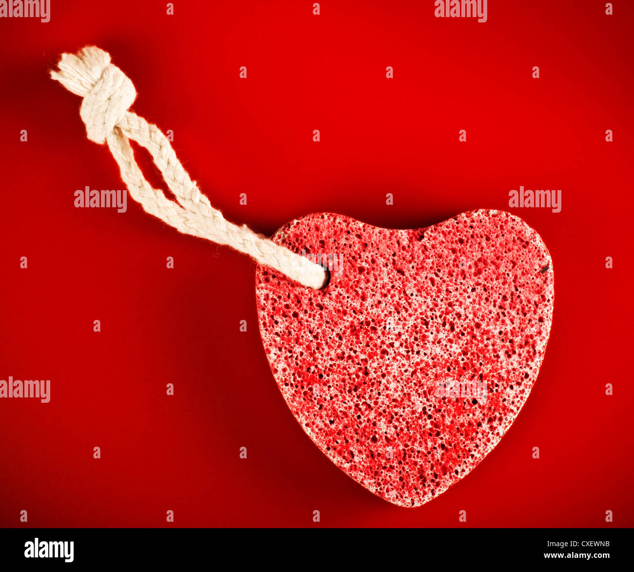 heart-shaped stone with rope Stock Photo - Alamy