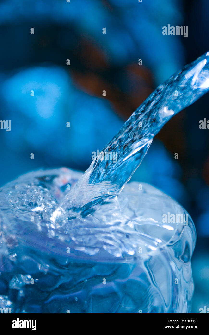 Water being poured into a glass Stock Photo - Alamy